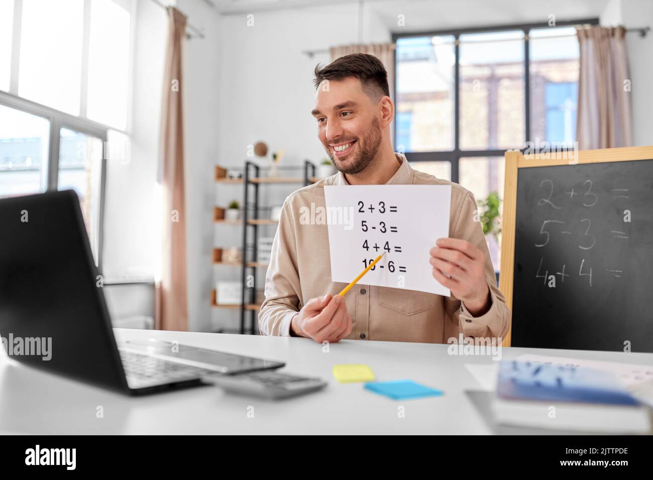 Male teacher smiling chalkboard hi-res stock photography and images - Alamy
