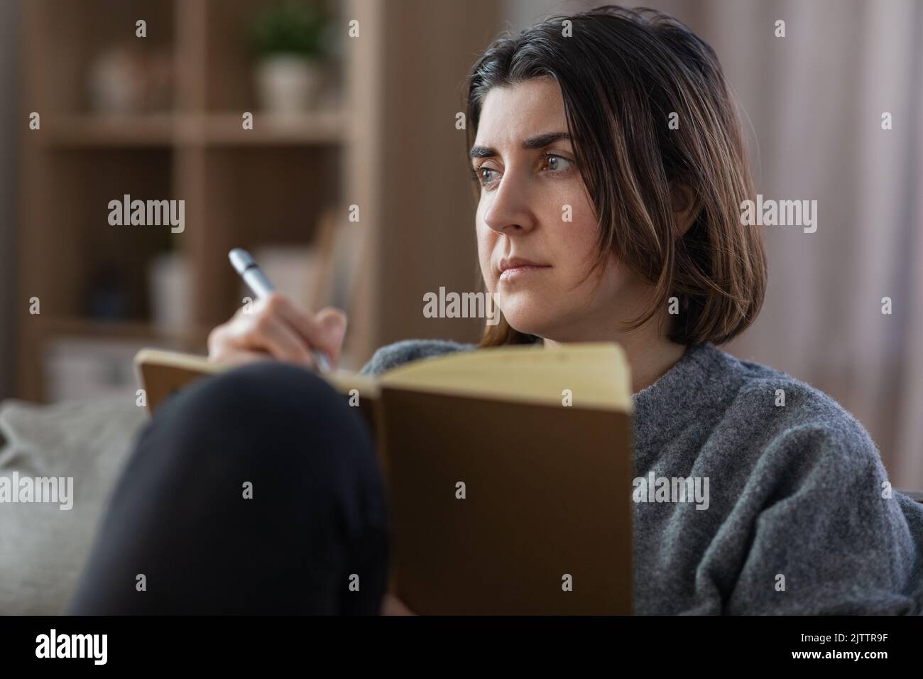 Person sad writing journal hi-res stock photography and images - Alamy