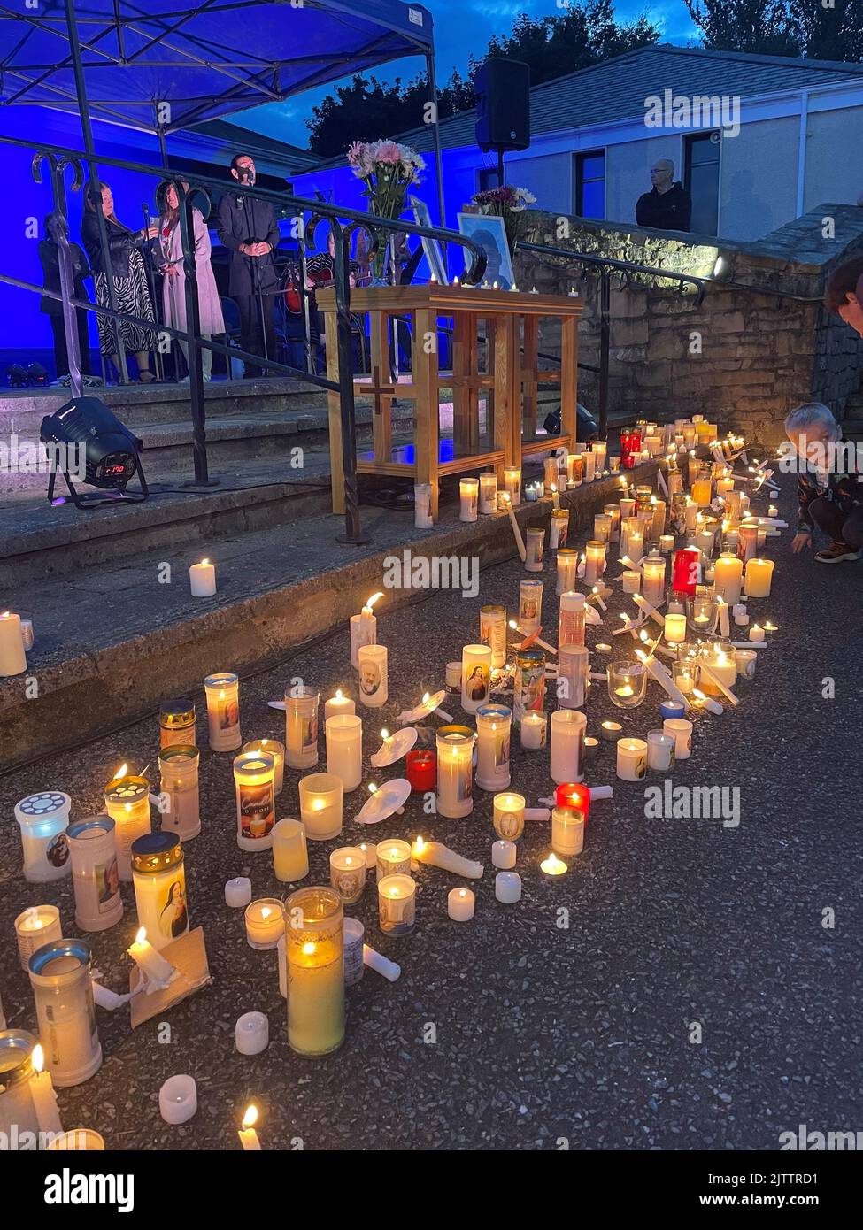 Candles are lit at St Oliver Plunkett church in Strathfoyle at a vigil ...