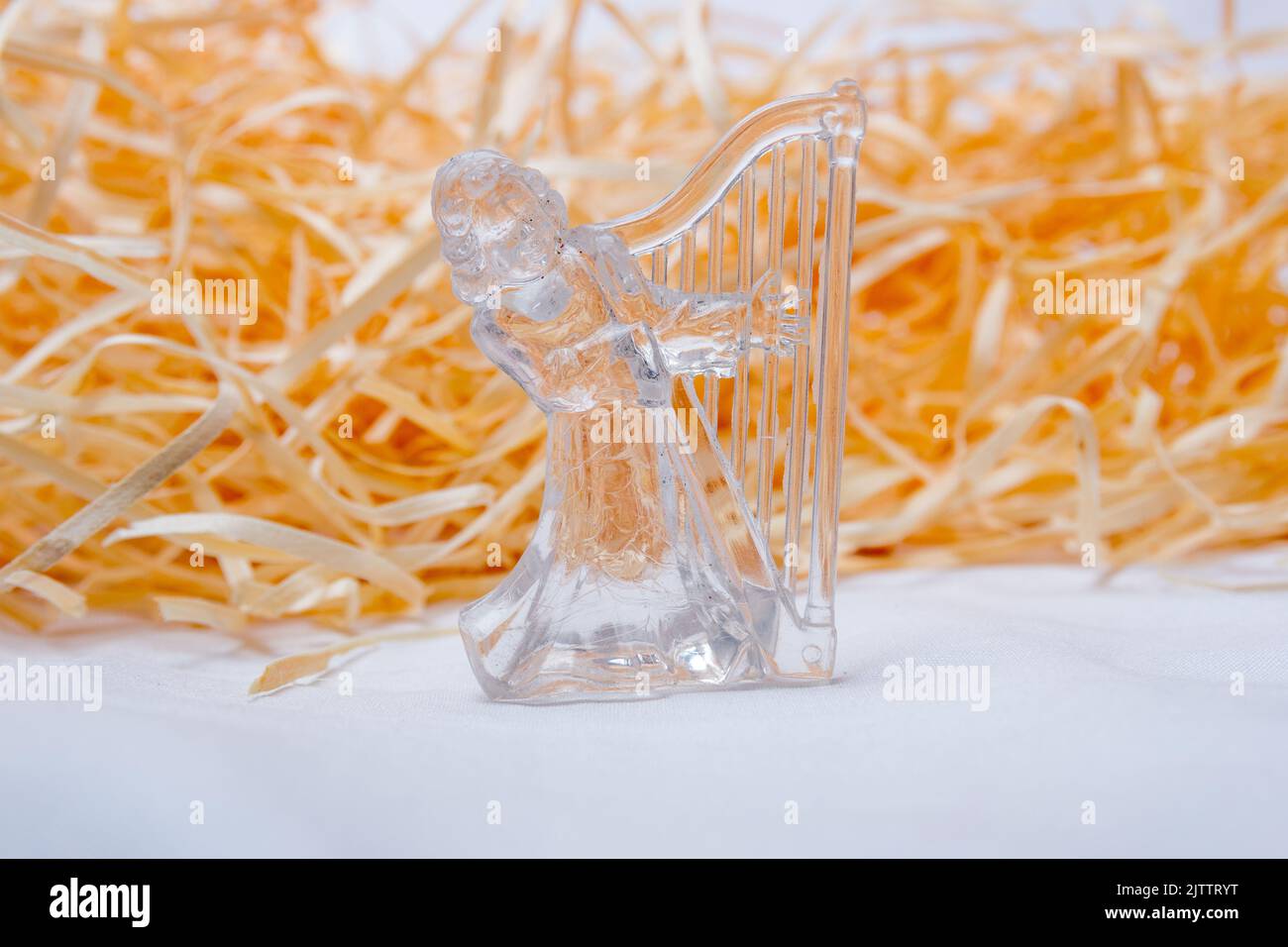 transparent angel for Christmas decoration on a straw background in Rio ...