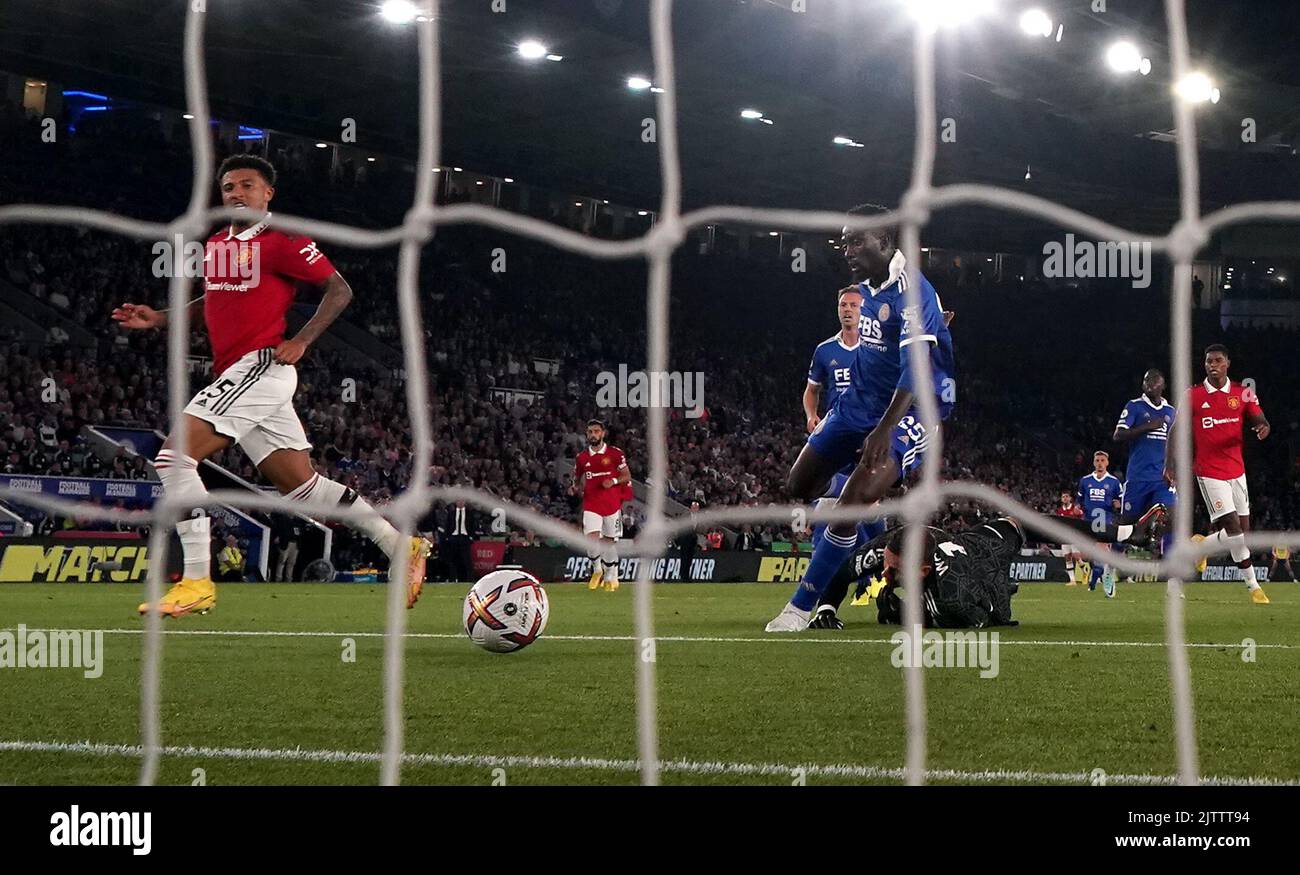 Manchester United's Jadon Sancho scores their side's first goal of the ...