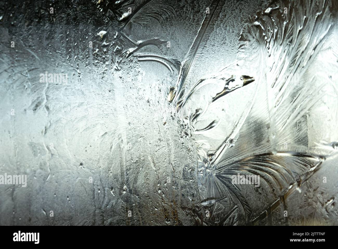 Frozen winter window with shiny ice frost pattern texture. Christmas ...