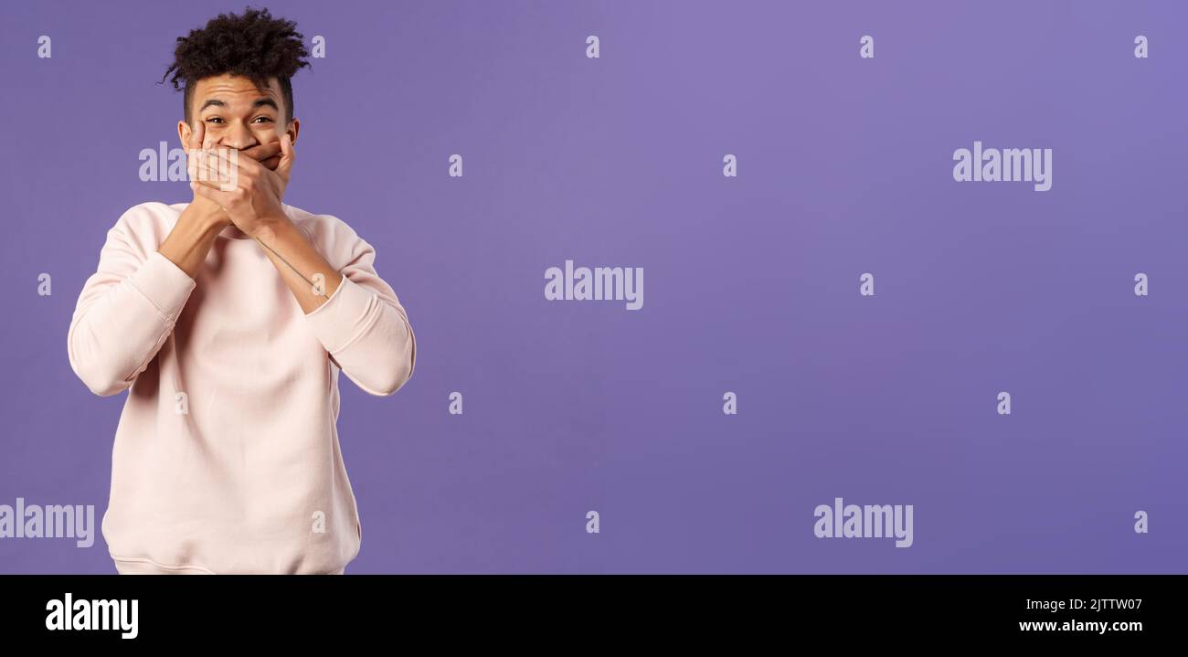 Portrait of amused, funny and carefree male student fooling around ...