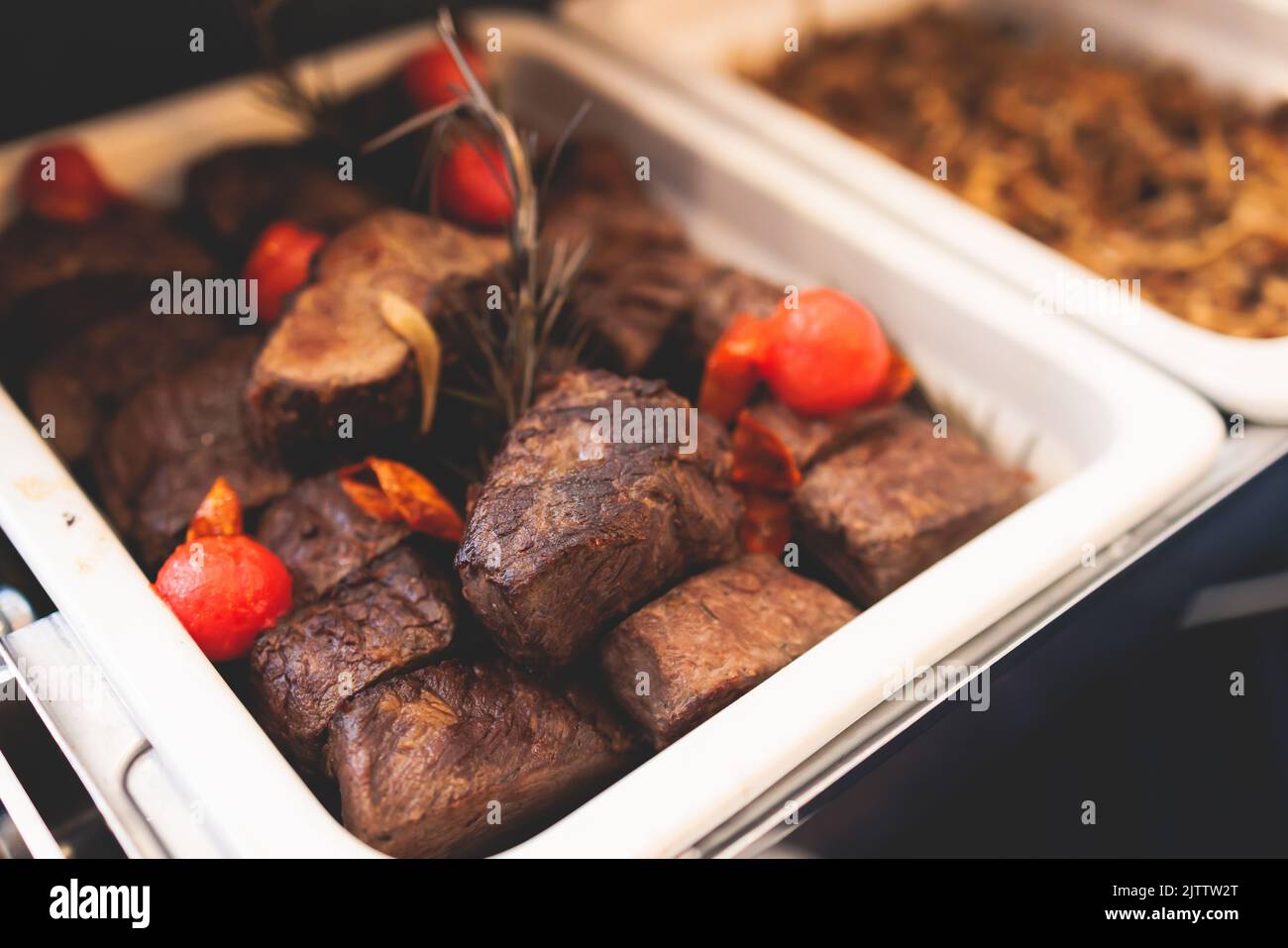 Beautifully decorated catering banquet table with different main course ...