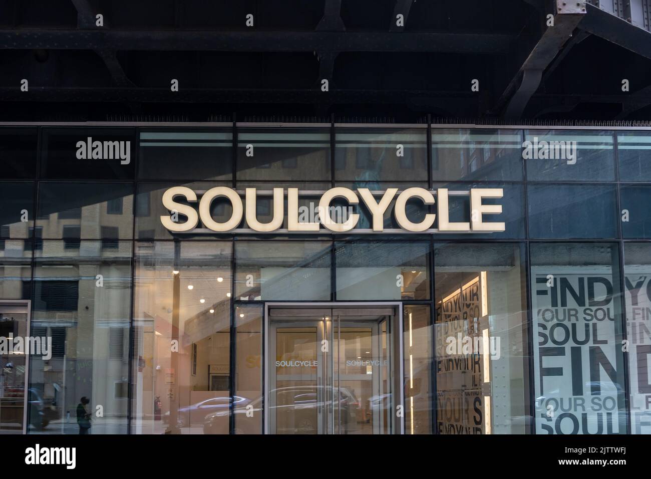 A SoulCycle sign above the entrance to a SoulCycle studio in New York ...