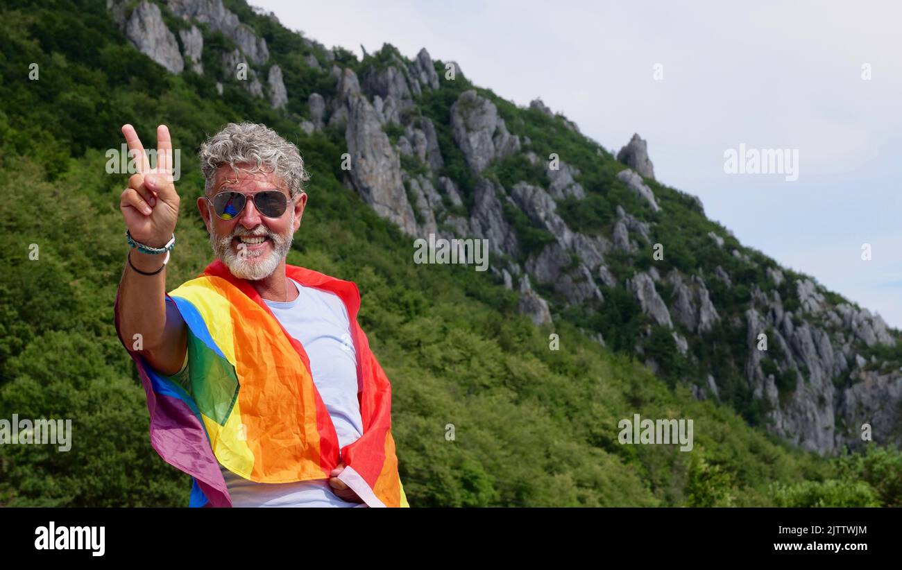Portrait of a gray-haired senior elderly Caucasian man bisexuality with ...