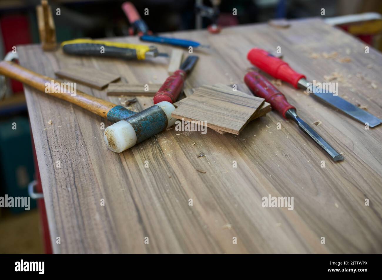 Various Woodworking Tools And Pieces Of Wood Lying On Work Surface In ...