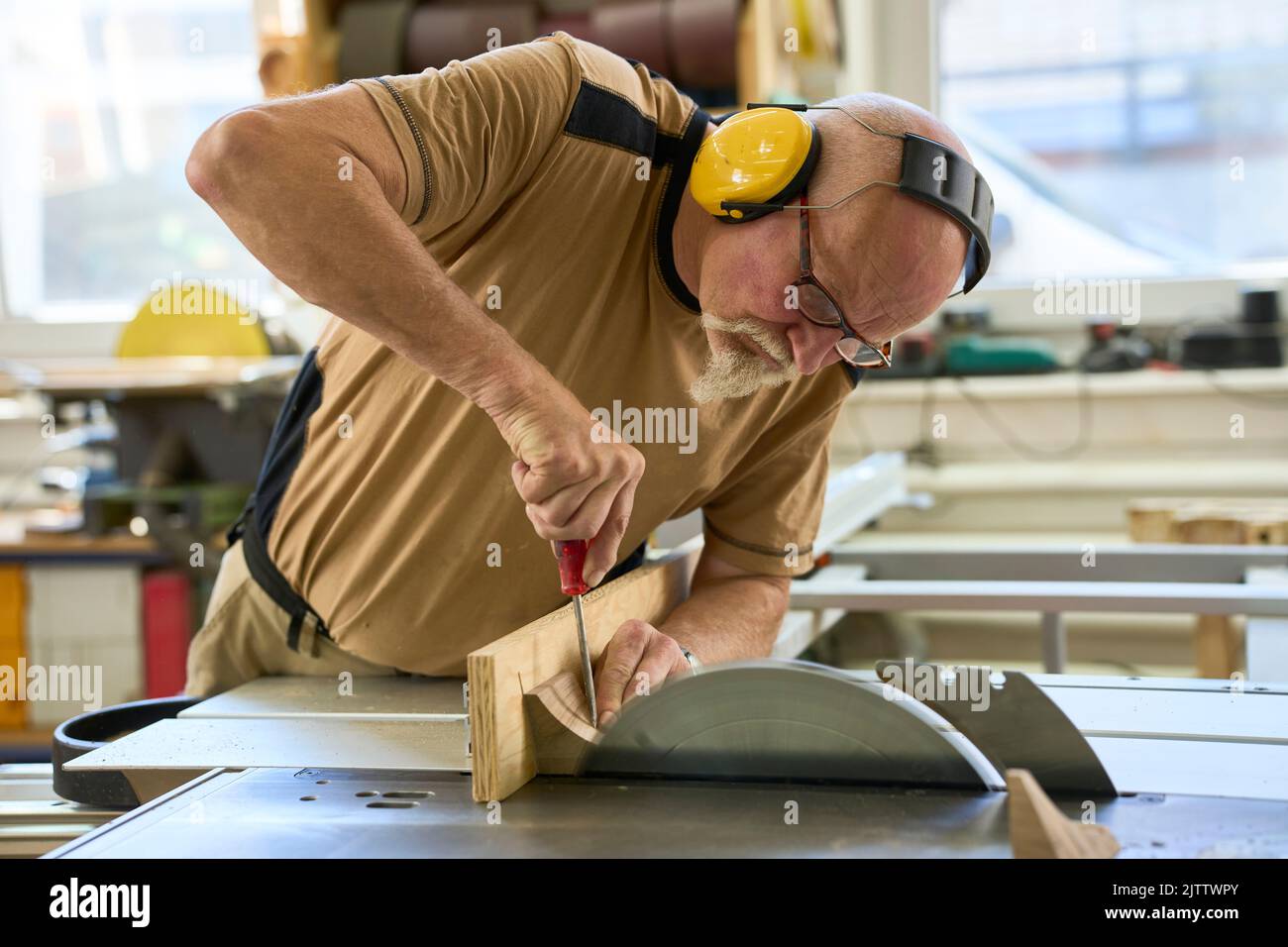 Antique Carpenter Working With Circular Saw On A Baroque Cabinet Base ...