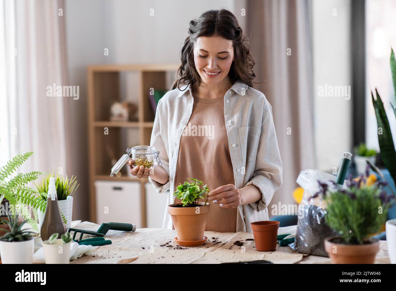 Female person fertilizing soil hi-res stock photography and images - Alamy