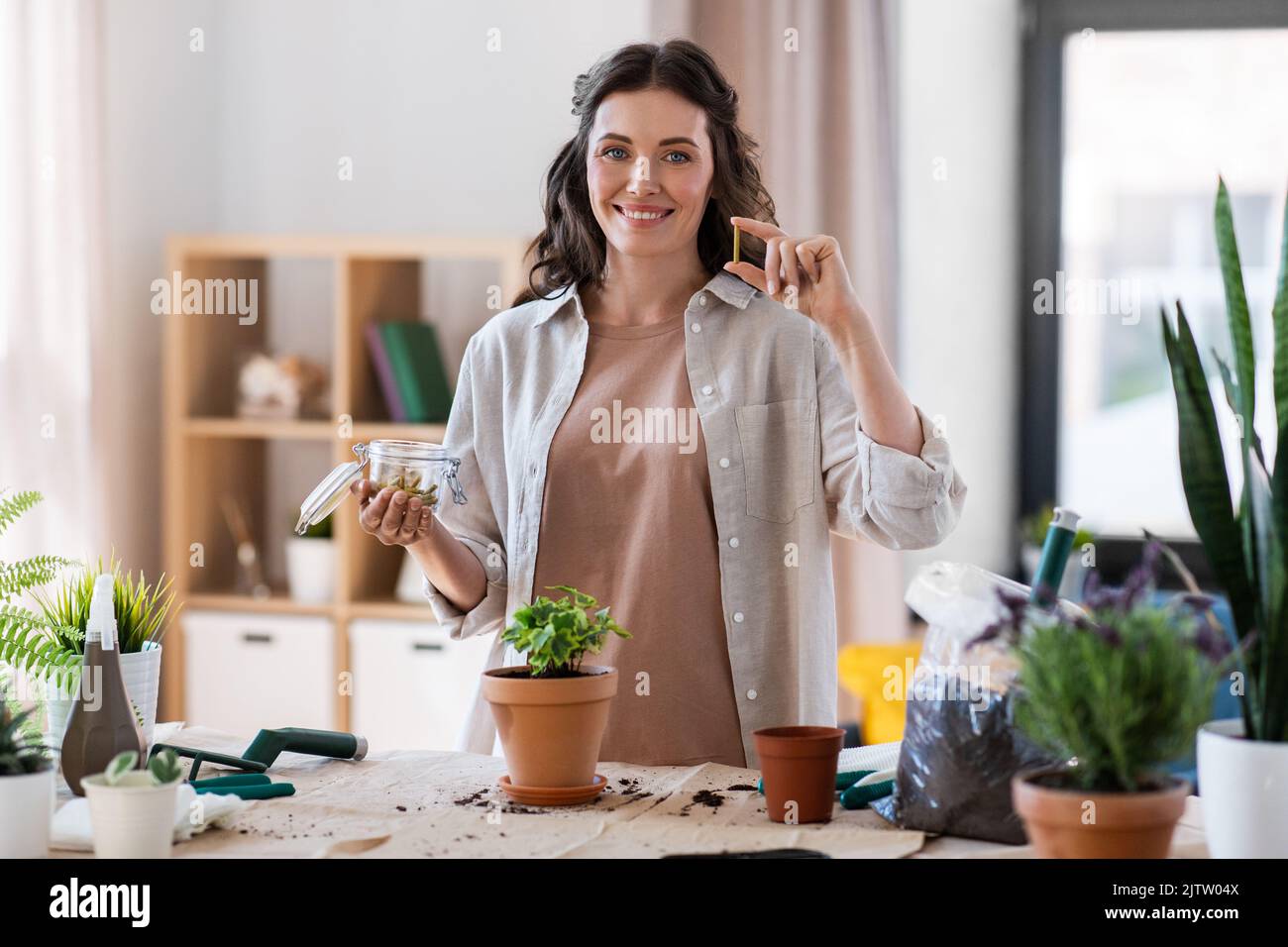 Female person fertilizing soil hi-res stock photography and images - Alamy