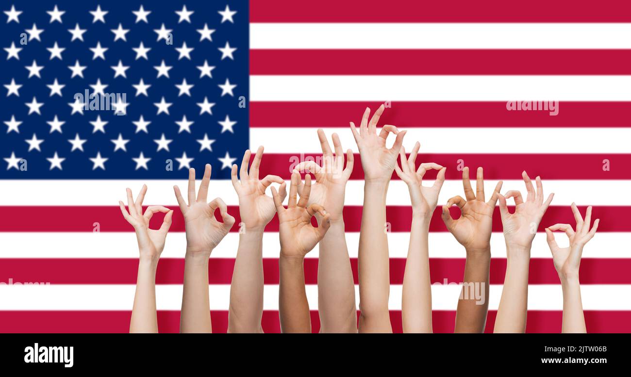 hands showing ok sign over flag of united states Stock Photo - Alamy