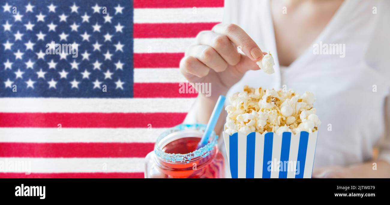 woman eating popcorn at 4th july party Stock Photo - Alamy