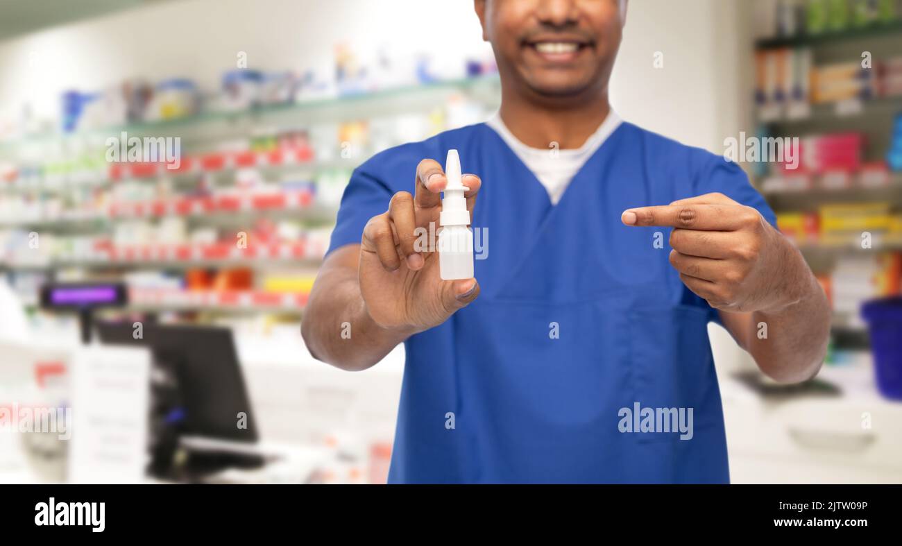 doctor or male nurse with medicine at pharmacy Stock Photo - Alamy
