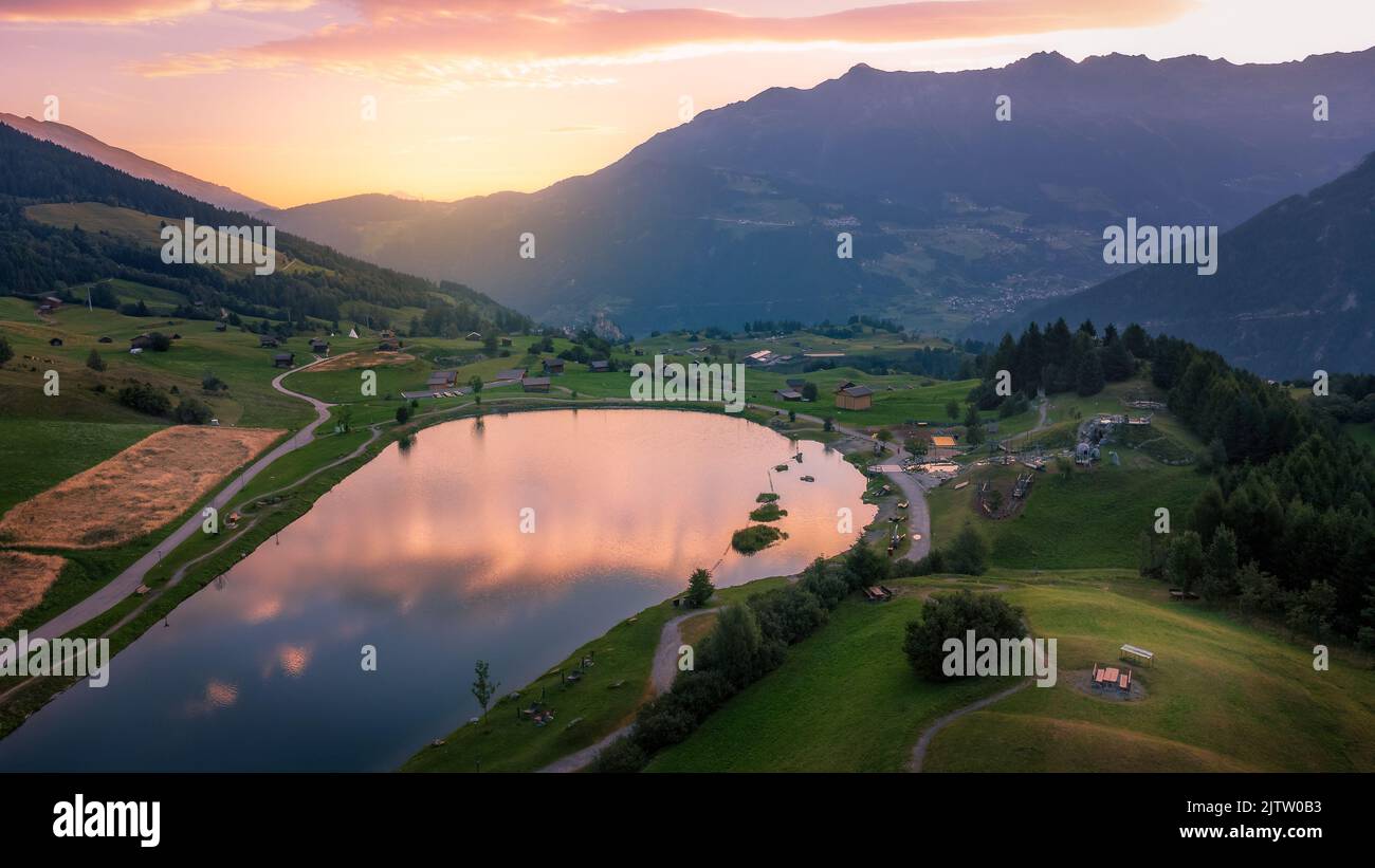 Aerial view at sunrise of lake Wolfsee in Fiss (Tirol, Austria) in ...
