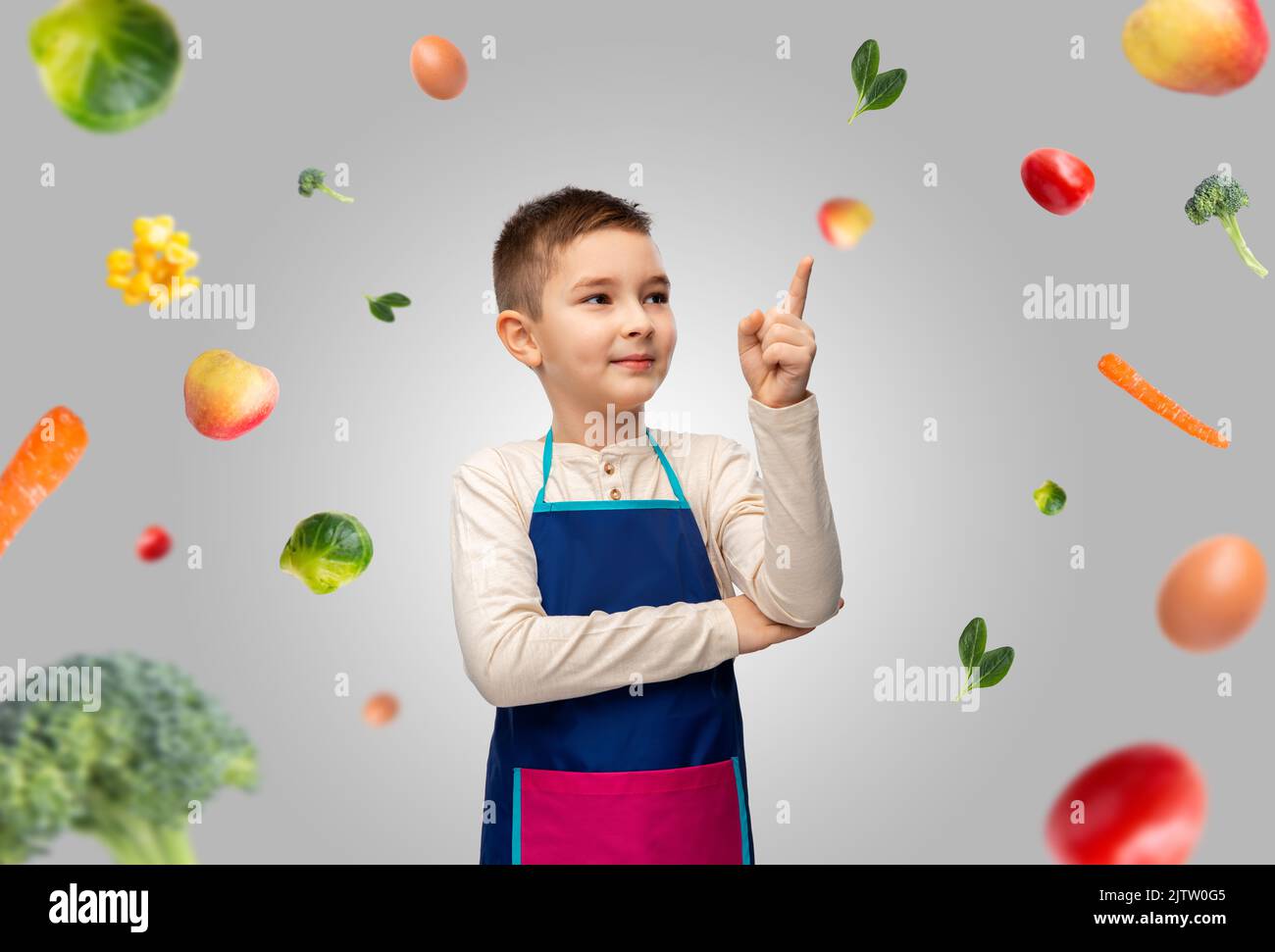 Boy eating and pointing hi-res stock photography and images - Alamy