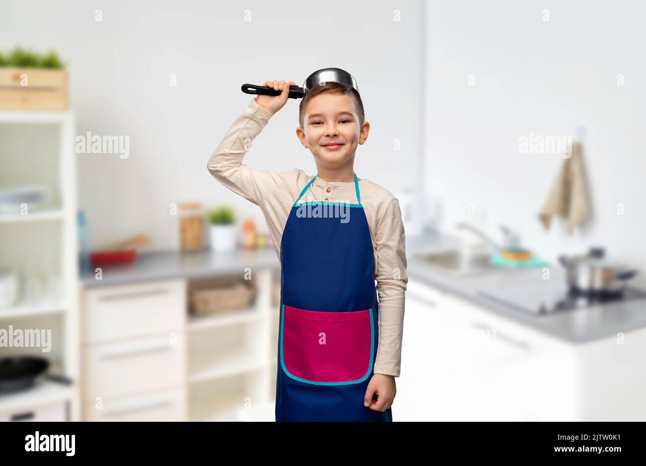 Teen boy cooking in the kitchen hi-res stock photography and images - Alamy