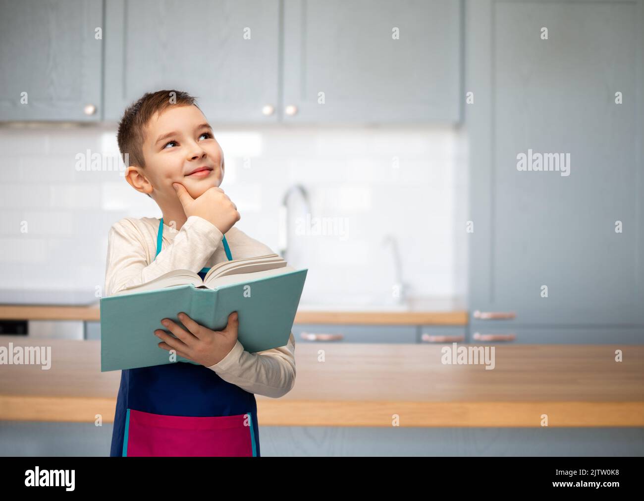 Kid thinking kitchen hi-res stock photography and images - Alamy