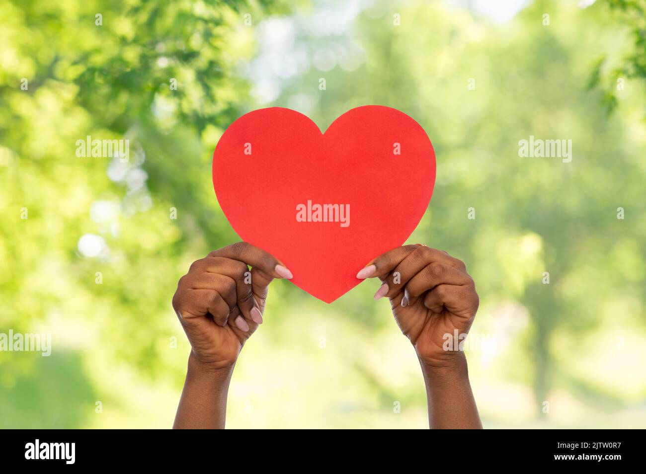 Black woman hands over heart hi-res stock photography and images - Alamy