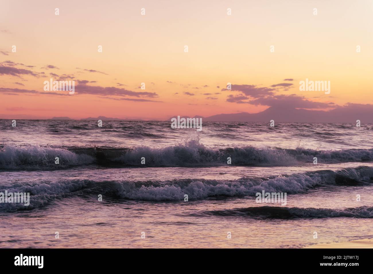 Sea splashing waves at dusk and beautiful sky background. Travel and ...