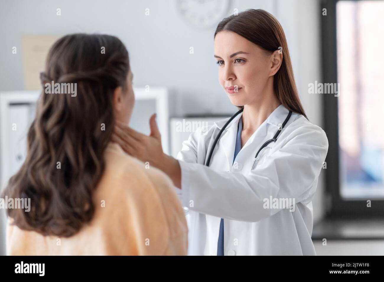 doctor checking lymph nodes of woman at hospital Stock Photo - Alamy