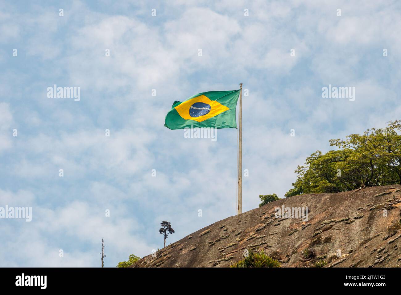 brazil flag outdoors with a beautiful blue sky in Rio de Janeiro Stock ...