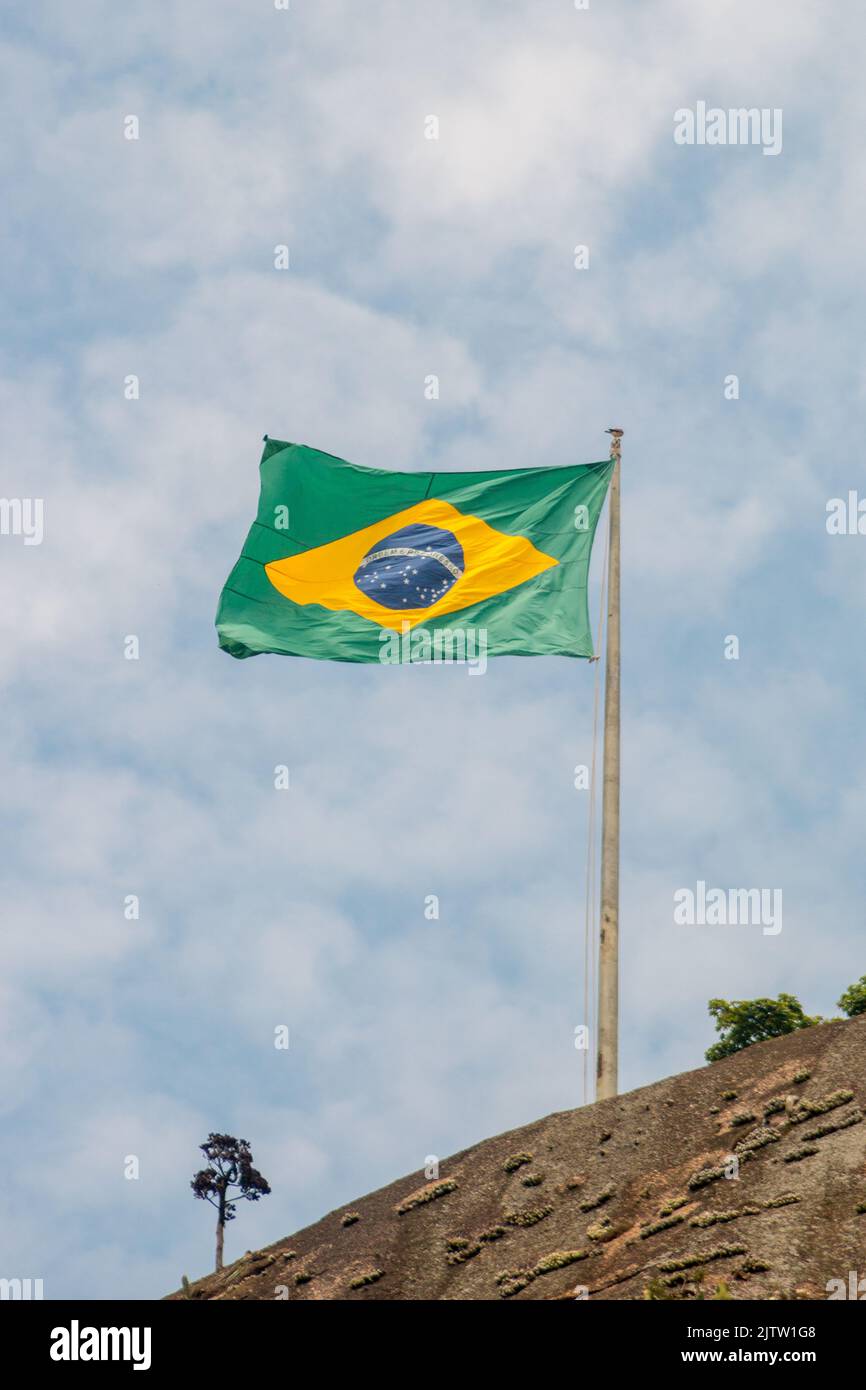 brazil flag outdoors with a beautiful blue sky in Rio de Janeiro Stock ...