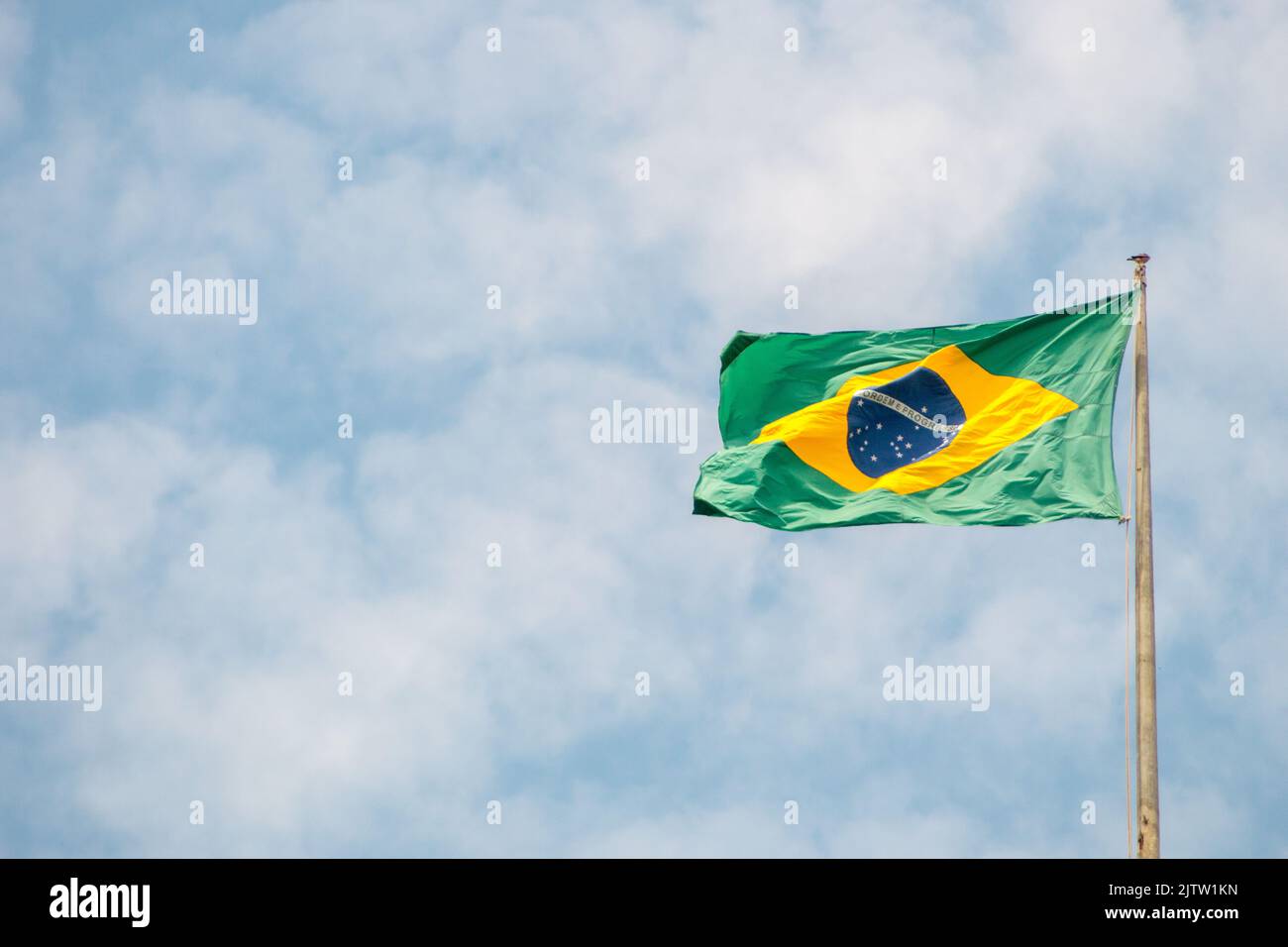 brazil flag outdoors with a beautiful blue sky in Rio de Janeiro Stock ...
