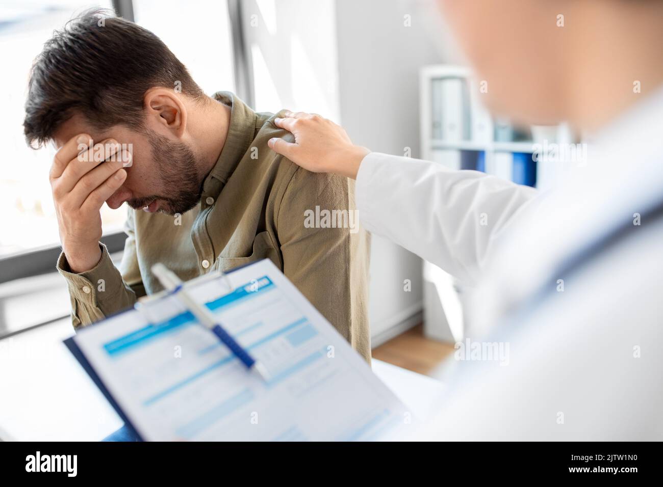 doctor and sad man with health problem at hospital Stock Photo - Alamy