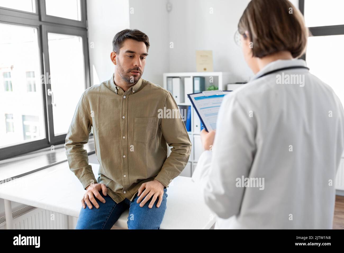 doctor and man with health problem at hospital Stock Photo - Alamy