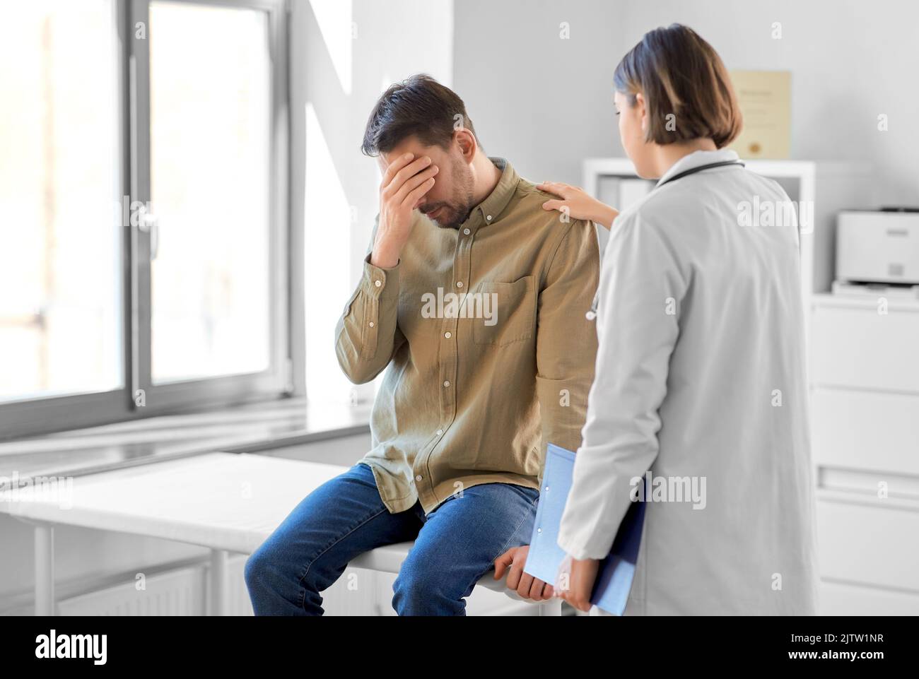 doctor and sad man with health problem at hospital Stock Photo - Alamy