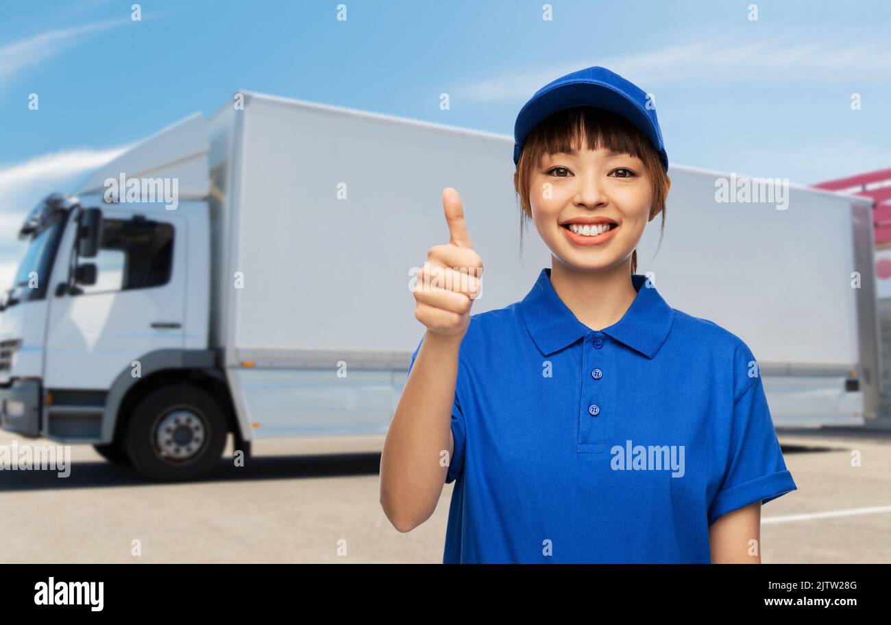 delivery woman showing thumbs up over truck Stock Photo - Alamy