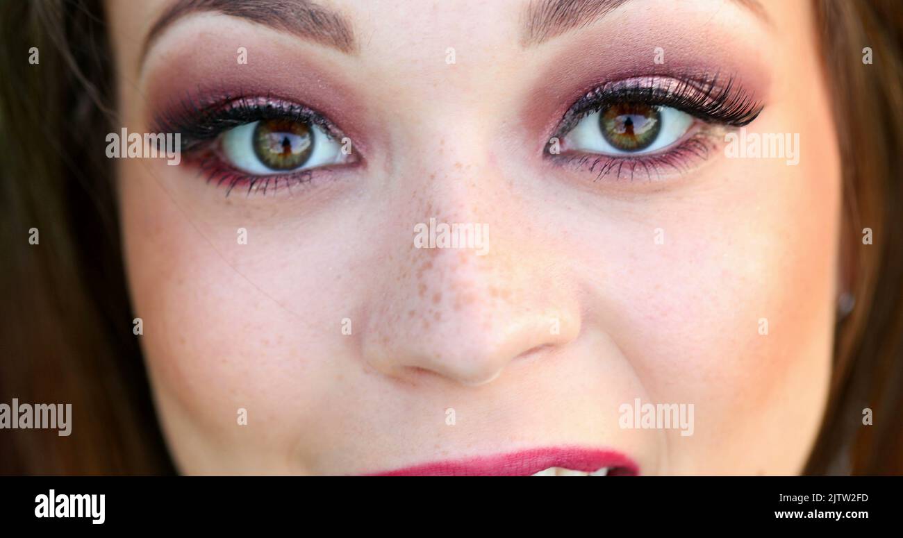 Pretty girl opening eyes with surprise macro Stock Photo - Alamy