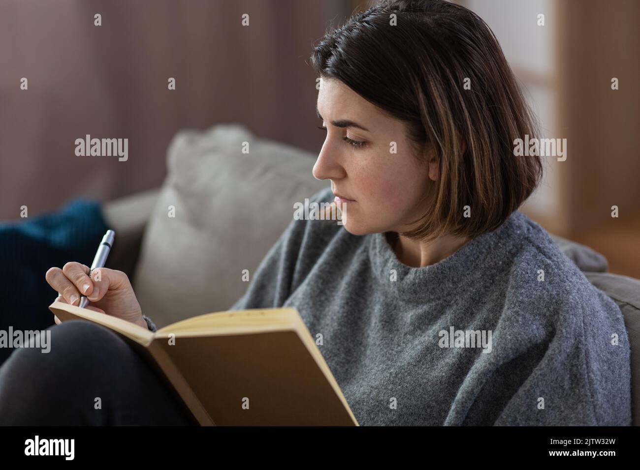 Person sad writing journal hi-res stock photography and images - Alamy