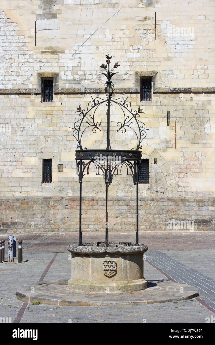 Medieval well in front of the15th century belfry (a UNESCO World ...