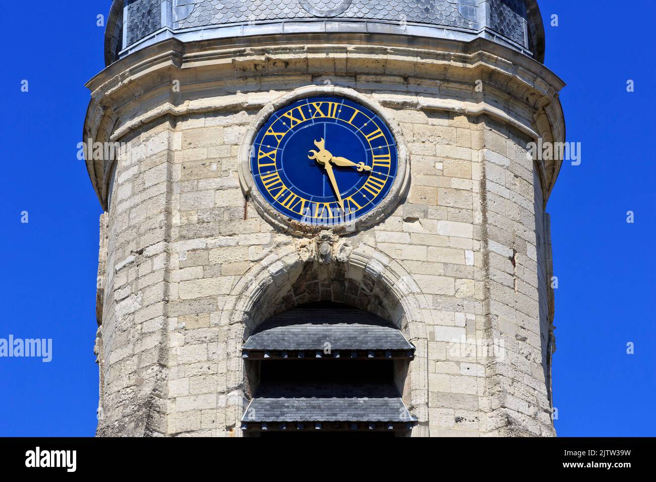 The clock of the 15th century belfry (a UNESCO World Heritage Site) in ...
