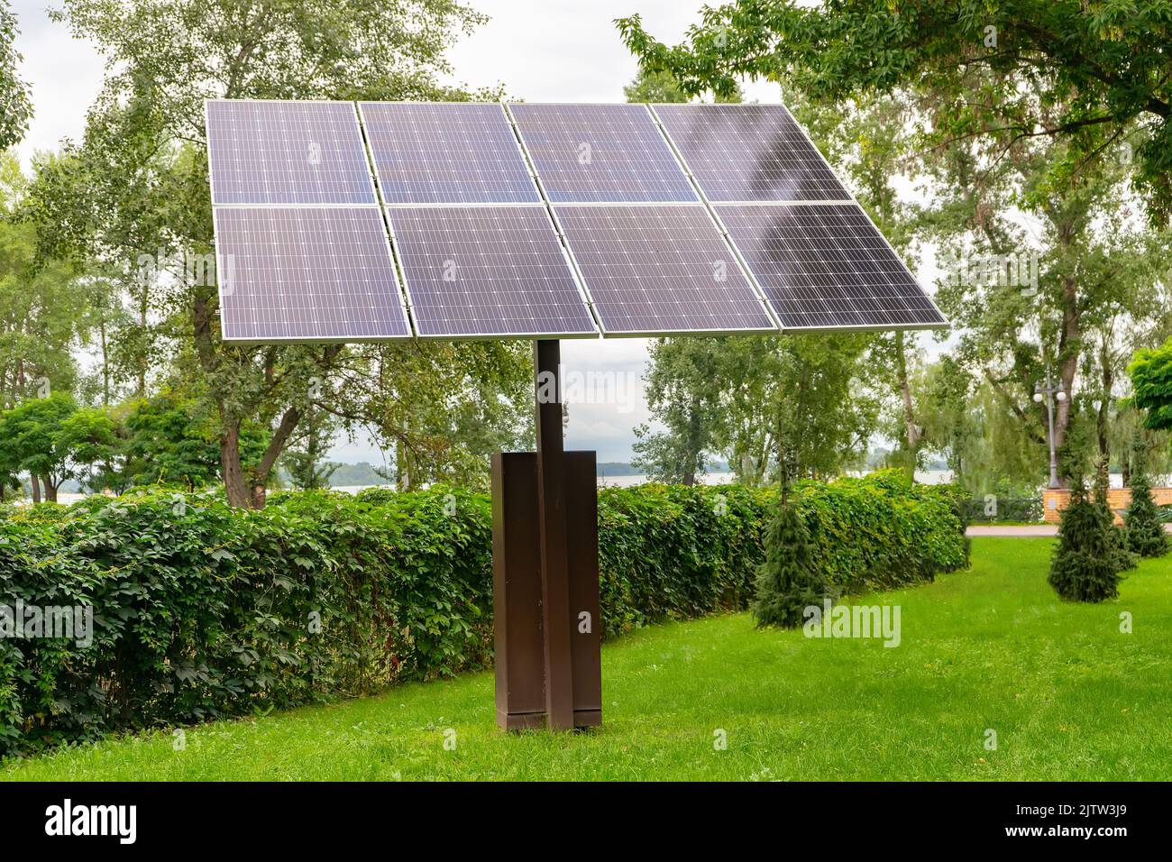 Solar panels in public park backgound. Photovoltaic modules for ...