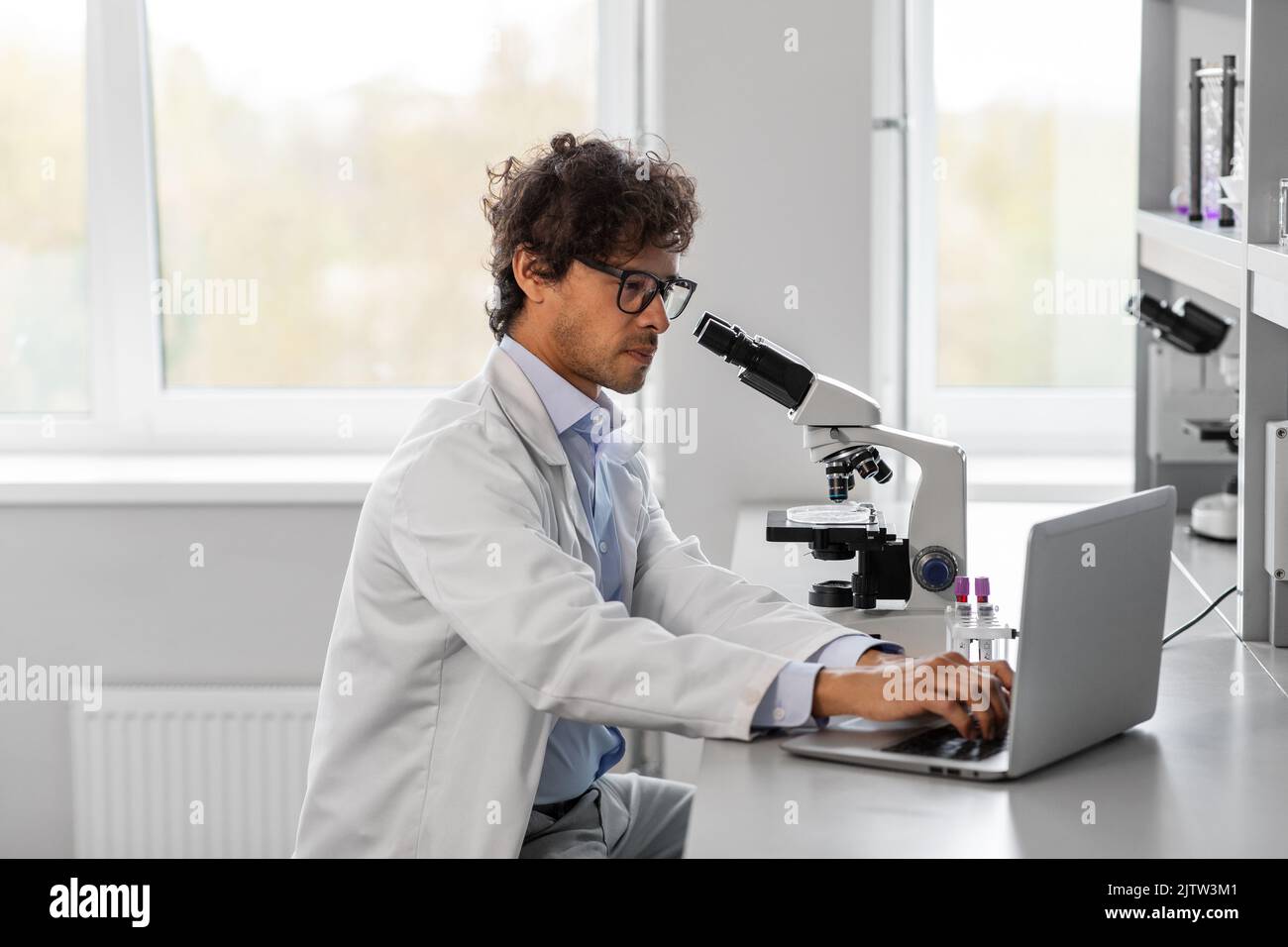 Scientist with microscope hi-res stock photography and images - Alamy