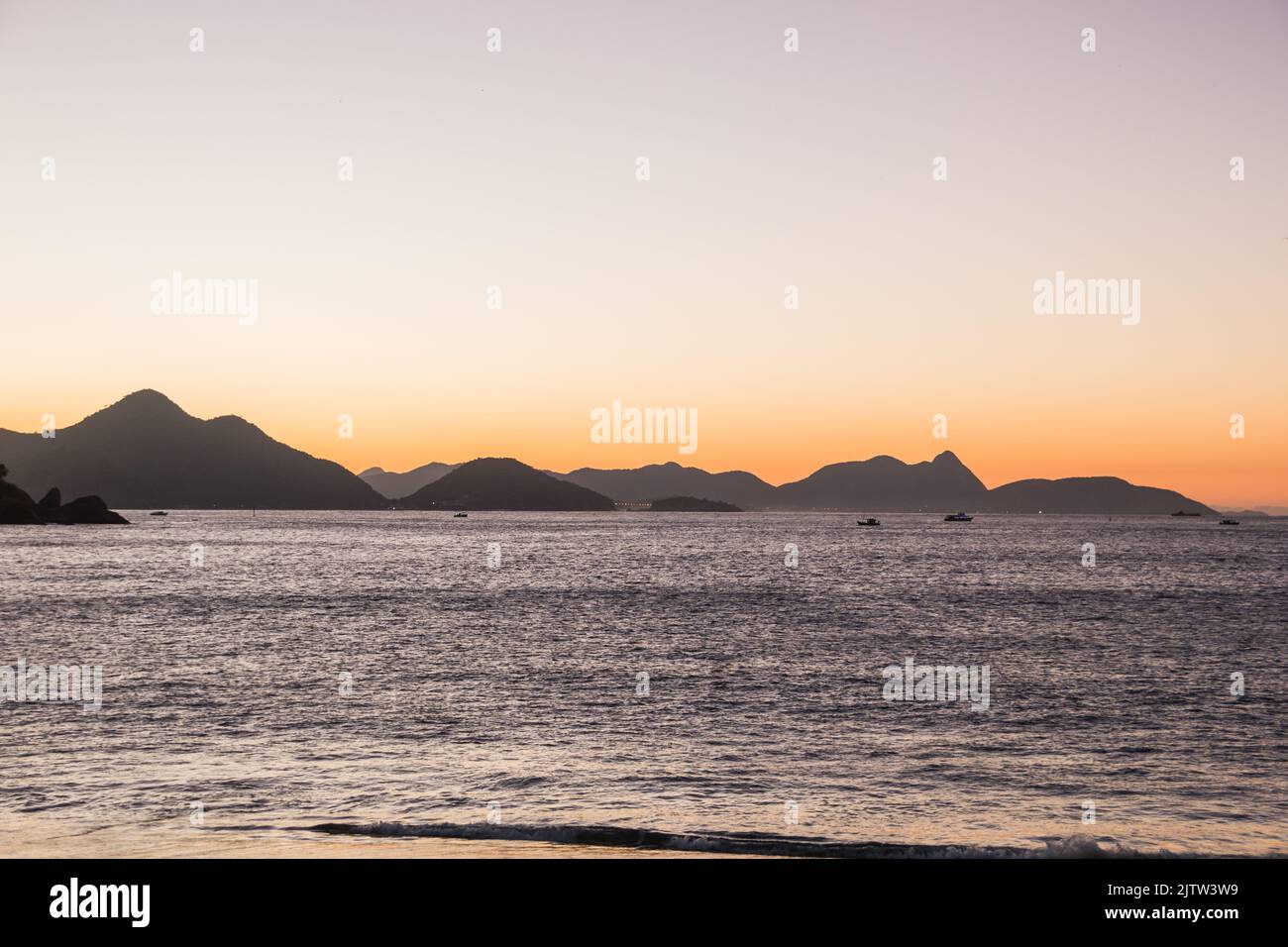sunrise on the red beach of the Urca neighborhood in Rio de Janeiro ...