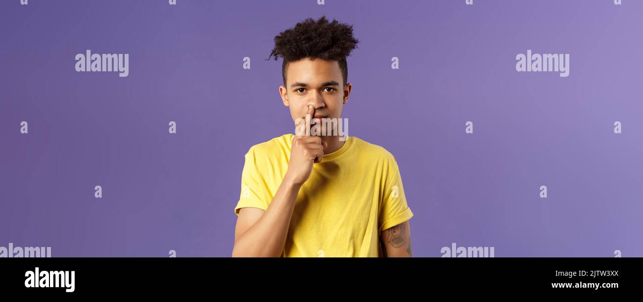 Close-up portrait of funny and unappropriate young hispanic teenage guy ...