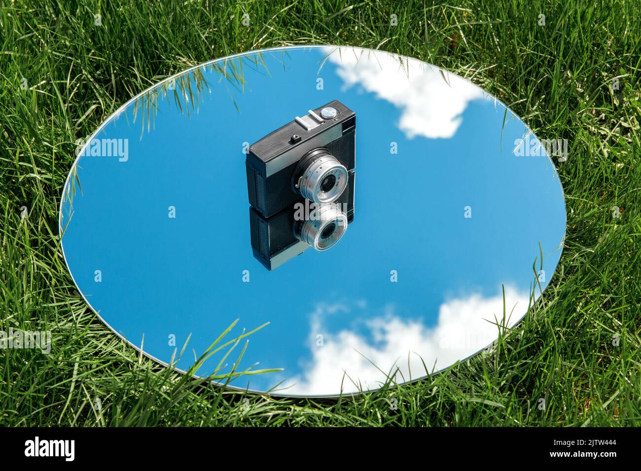 Round mirror on grass hi-res stock photography and images - Alamy