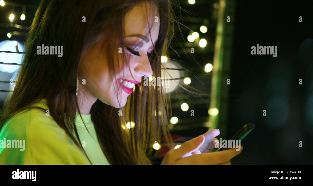 Pretty Girl Looking At Cellphone Screen Smiling Authentic Smile Young