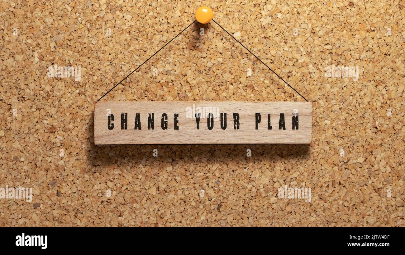 Change your plan is written on wooden surface. Wooden concept. Work and ...