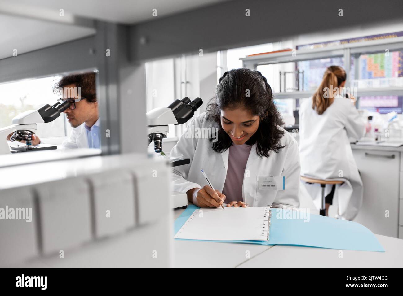 Group scientists working scientific test hi-res stock photography and ...