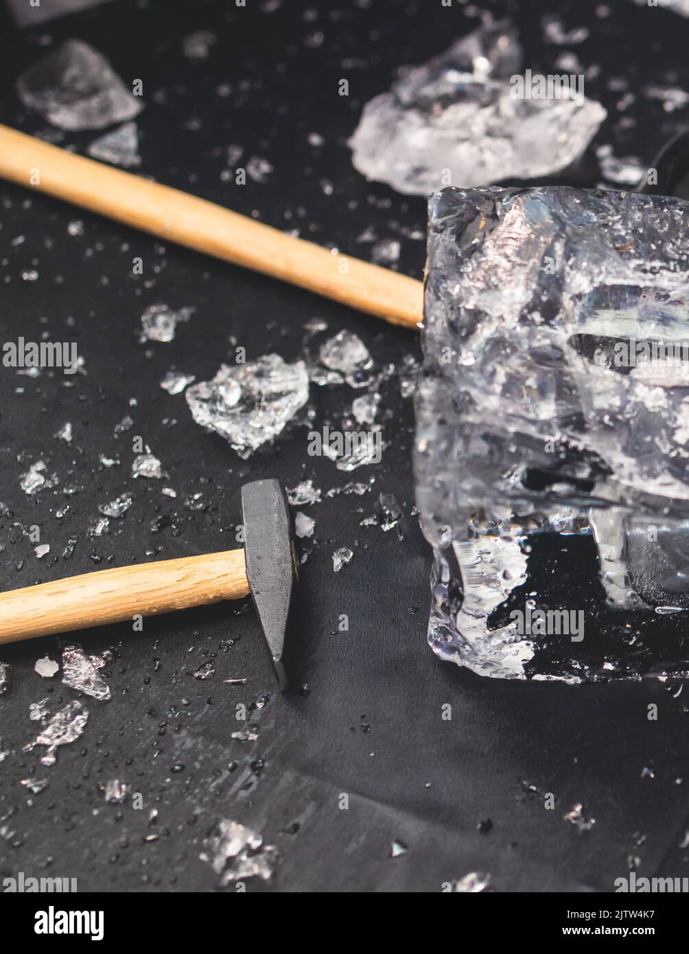 Process of breaking the ice with hammer and ice pick, group of people ...