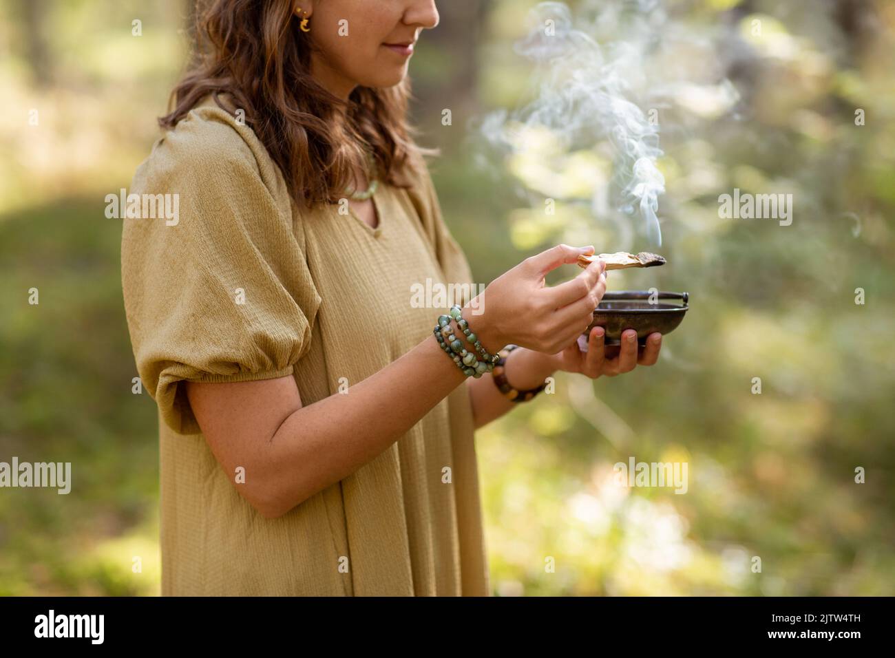 woman with palo santo performing magic ritual Stock Photo - Alamy