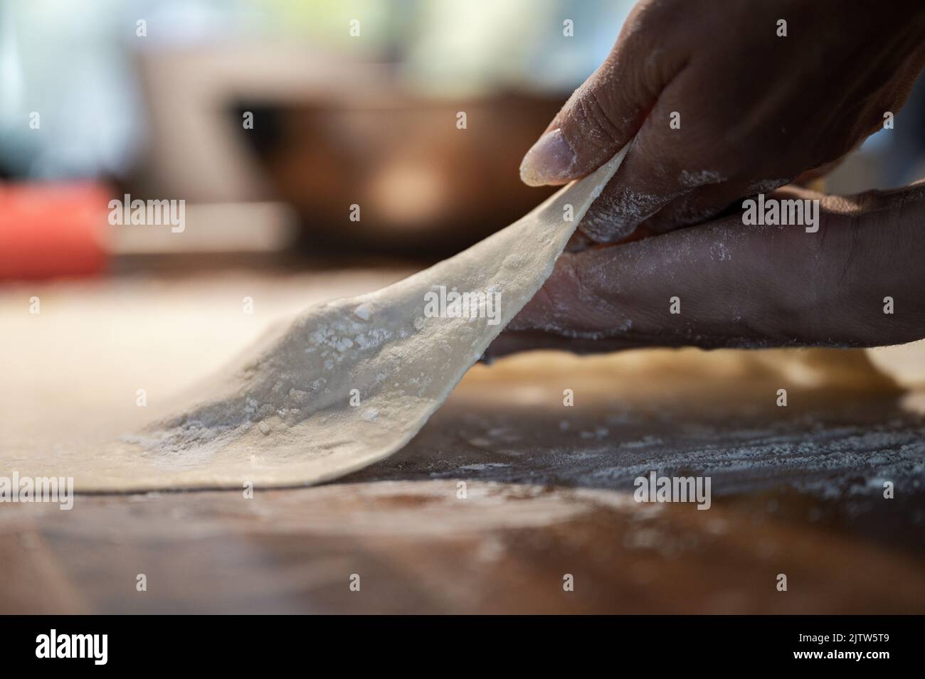 Low angle close up view of female hands stretching and pulling delicate ...
