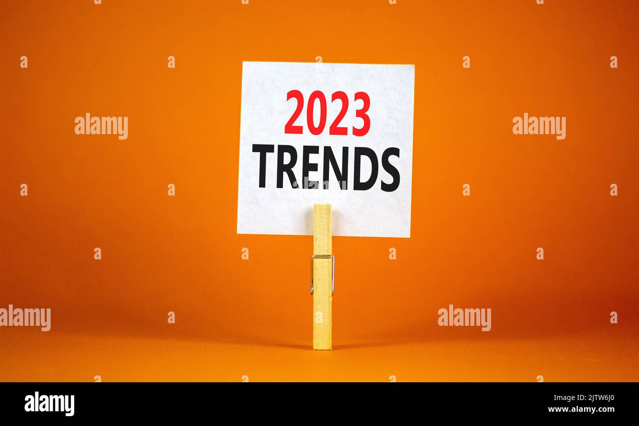 2023 Trends symbol. White paper with words 2023 Trends, clip on wooden ...