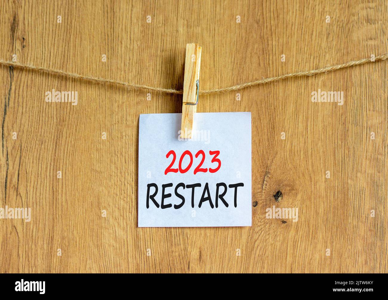 2023 Restart symbol. White paper with words 2023 Restart, clip on ...