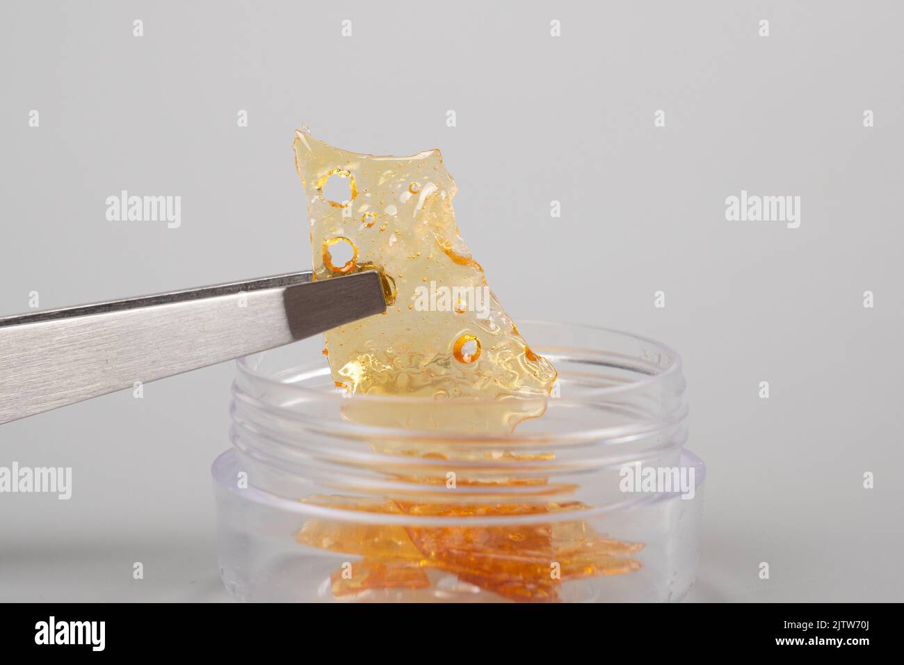 cannabis golden wax, piece high thc dab Stock Photo - Alamy