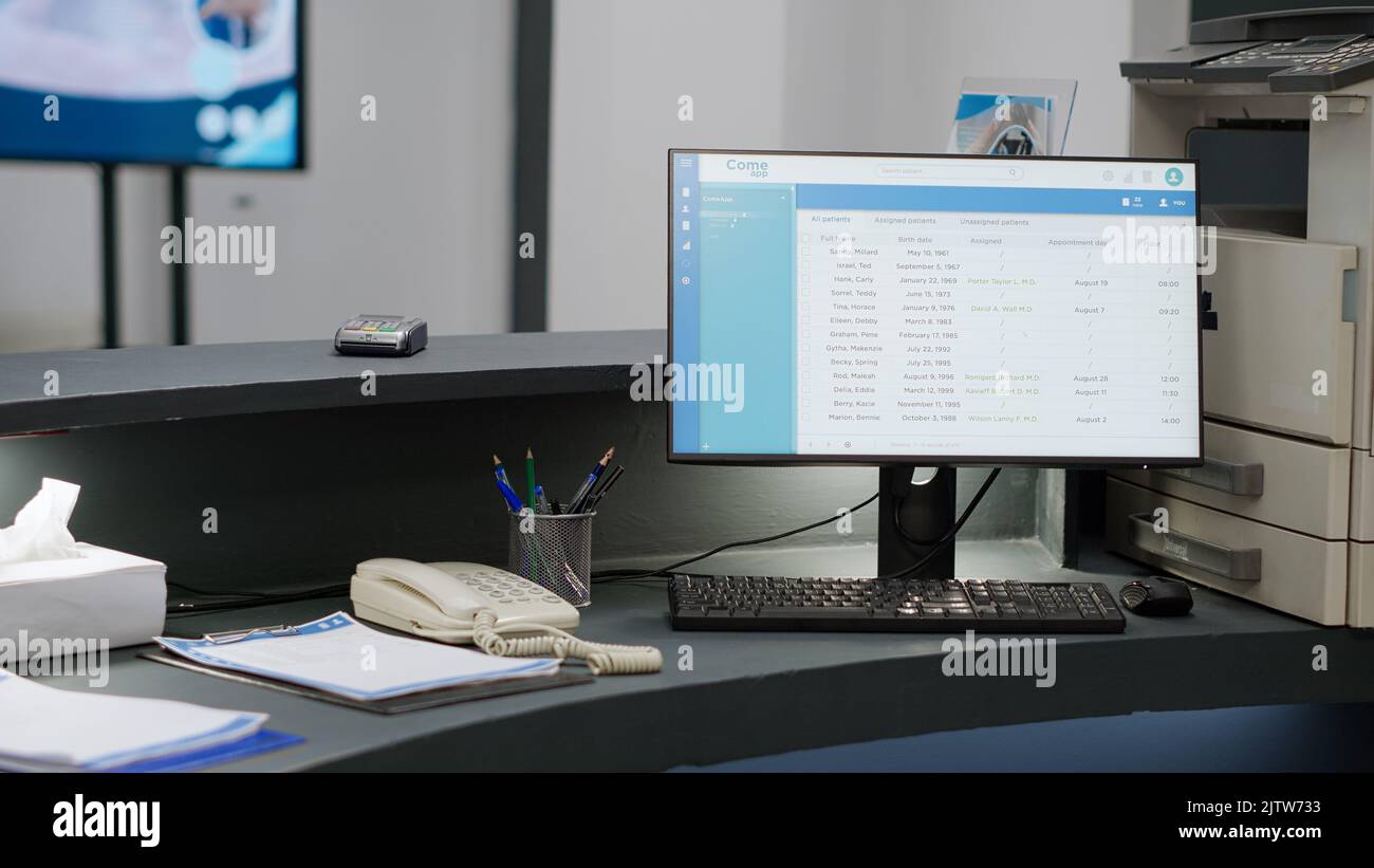 Health center registration desk with medical appointments on computer ...